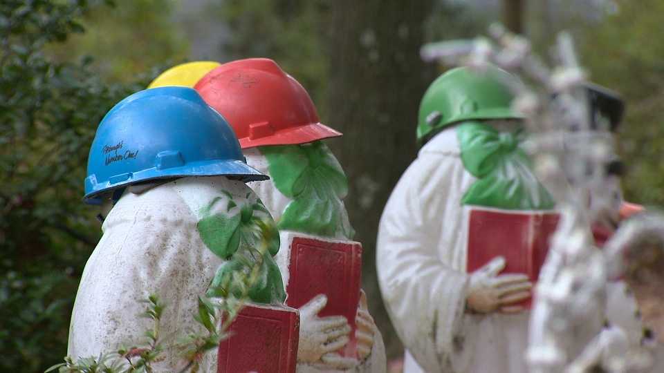 Offensive signs and "trashed" figurines surround a home once a holiday ...