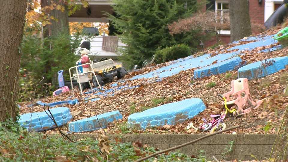 Offensive signs and "trashed" figurines surround a home once a holiday ...