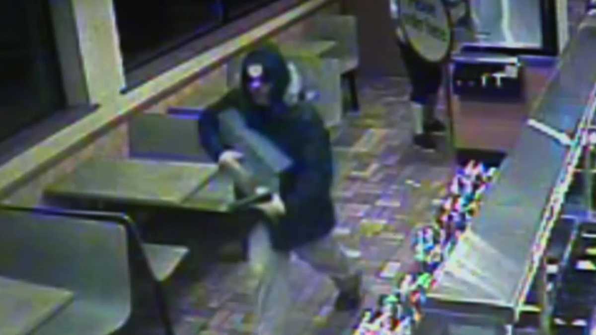 Surveillance images: Clown robber at Subway