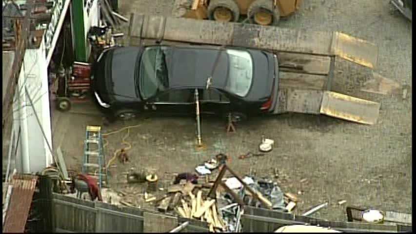 Photos: Vehicle falls off lift at Butler County garage