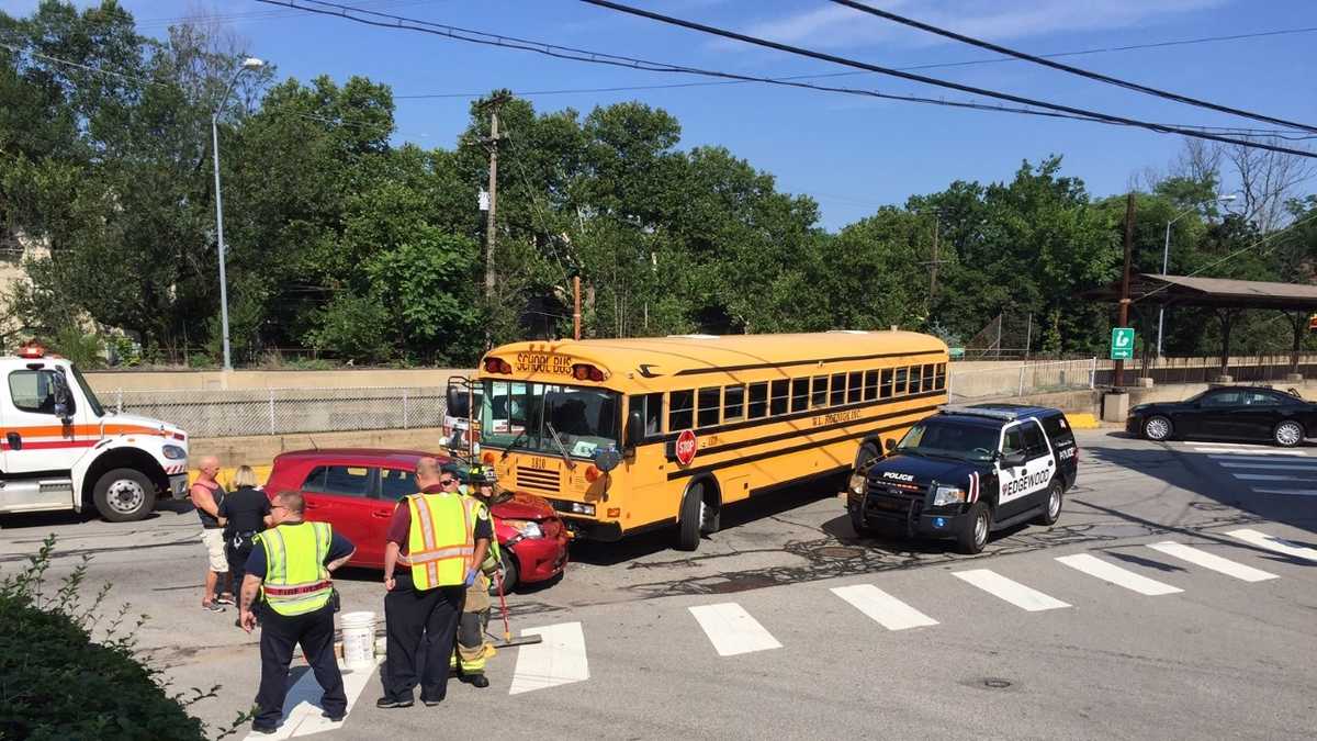 1 injured when car crashes into school bus
