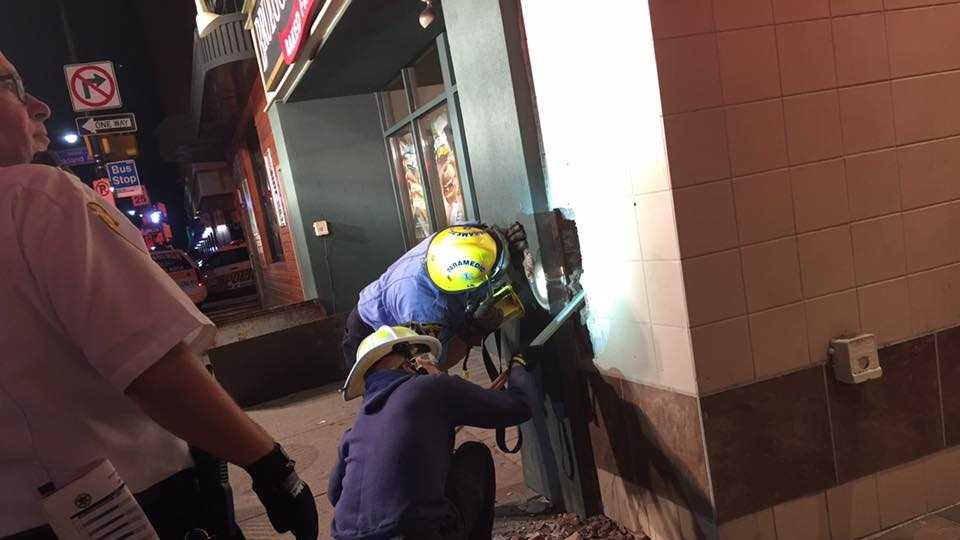 Photos: Man rescued after becoming stuck between Oakland buildings