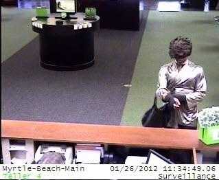 Police: Cross-Dressing Bank Robber Caught On Camera