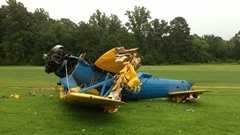 Fire official: WWII biplane clips tree, crashes