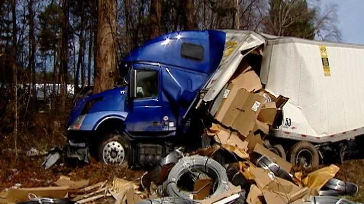 Tractor-trailer truck goes off interstate, hits tree