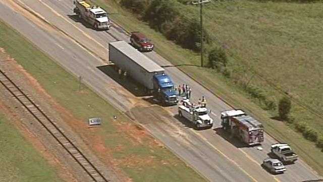 Diesel leaking from truck's punctured tank shuts down road