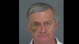 Police: Husband charged after wife dies in wreck