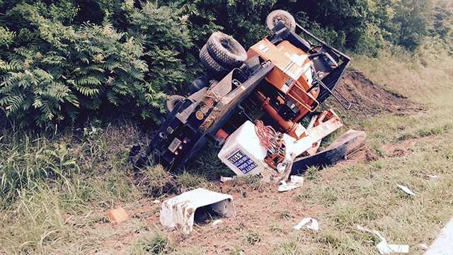 Tree service bucket truck overturns in crash with 18-wheeler, van