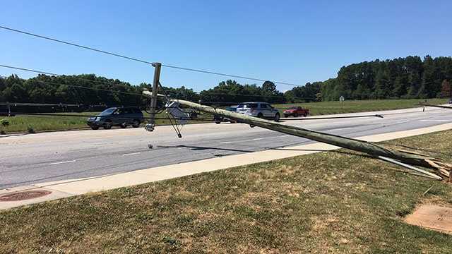 Tractor-trailer downs utility pole; power out, traffic backed up