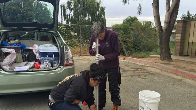 Volunteers work as scientists testing river and ocean water quality