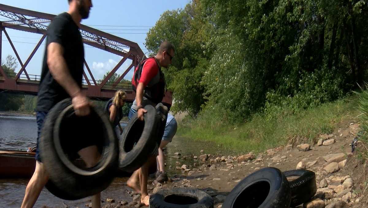 Volunteers pull tires, trash from Ausable River