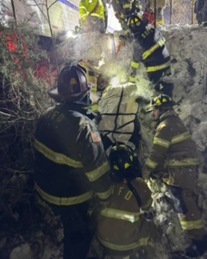 Emergency crews rescue semitrailer driver suspended over embankment