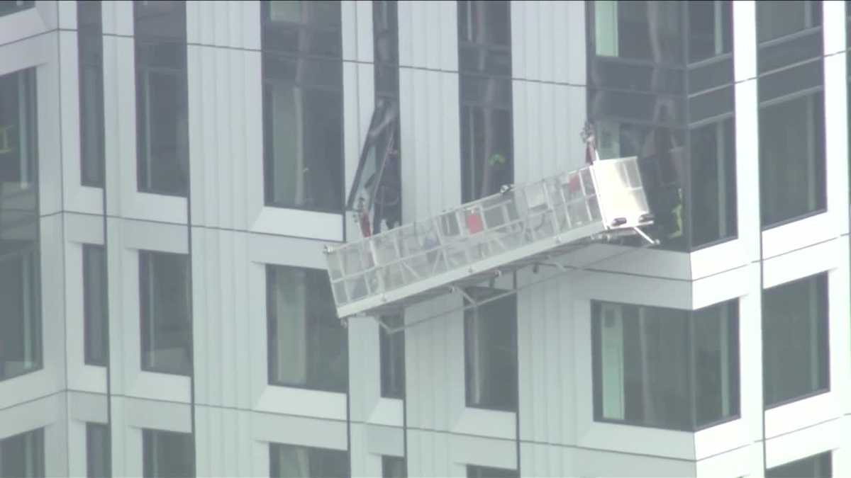 Firefighters rescue window washers from dangling scaffold outside ...