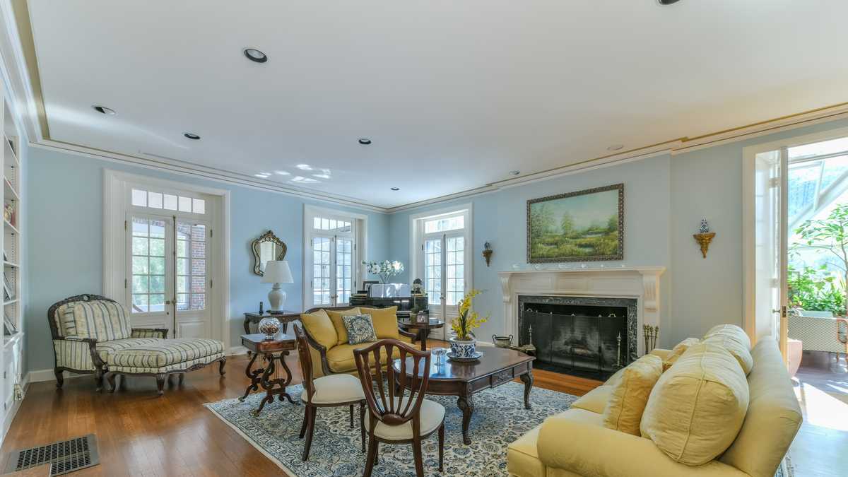 $4.85M stately brick colonial has conservatory, superb gym