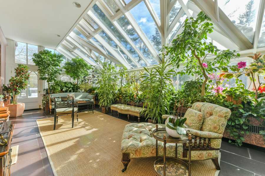 $4.85M stately brick colonial has conservatory, superb gym