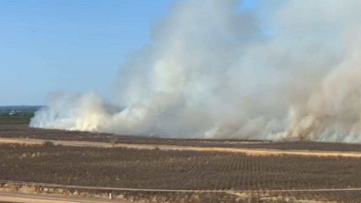 Fire burns near warehouses in Patterson