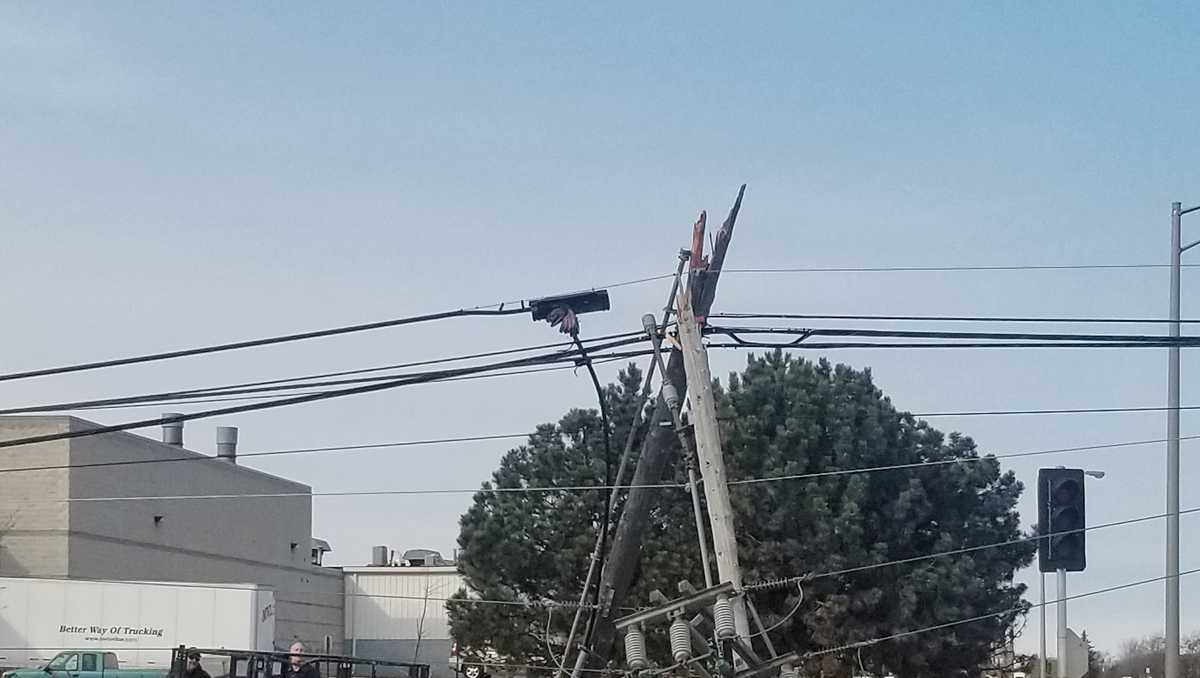 Vehicle pulling trailer crashes into utility poles, knocks out power