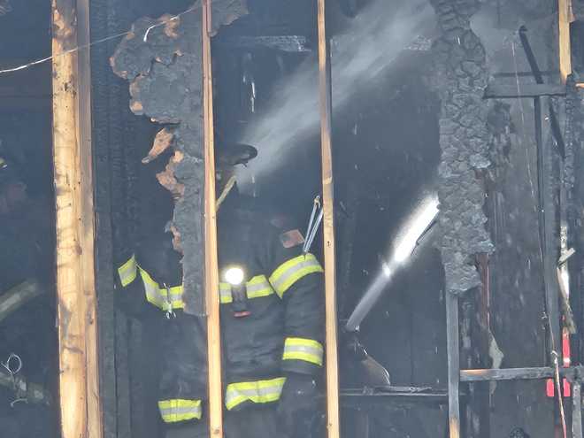 Kansas City Fire Department battles house fire at E. 77th Street
