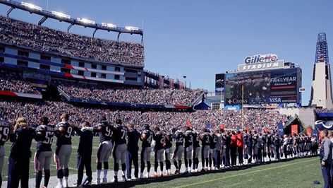Photos: Patriots stand during national anthem before Panthers game