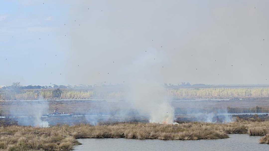 Slidell firefighters responding to a marsh fire