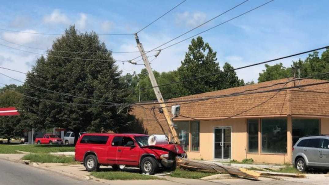 Car crashes into pole, forces road closure for hours