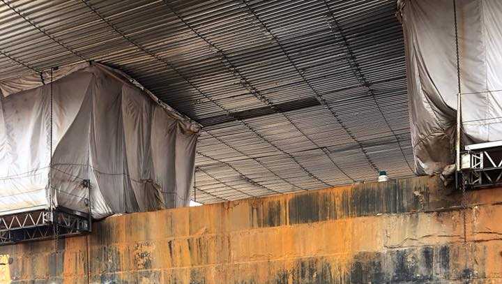 Secret Santa leaves Christmas tree with clothes underneath for homeless