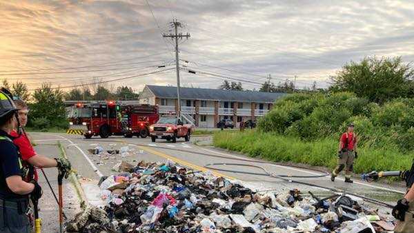 Cleanup underway after garbage truck driver dumps burning trash on ...
