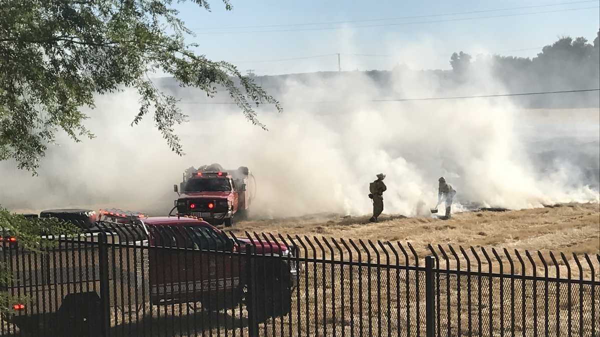 Crews battle grass fire off Highway 99 in Sacramento