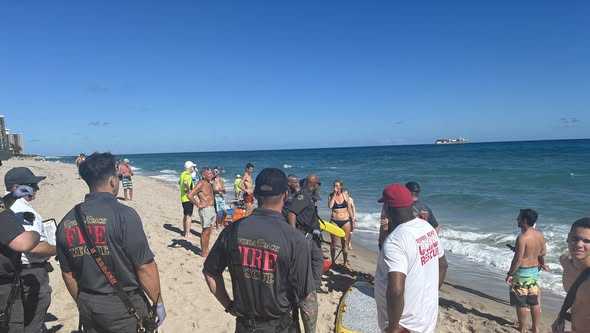 Paraglider falls into ocean, lifeguards save him
