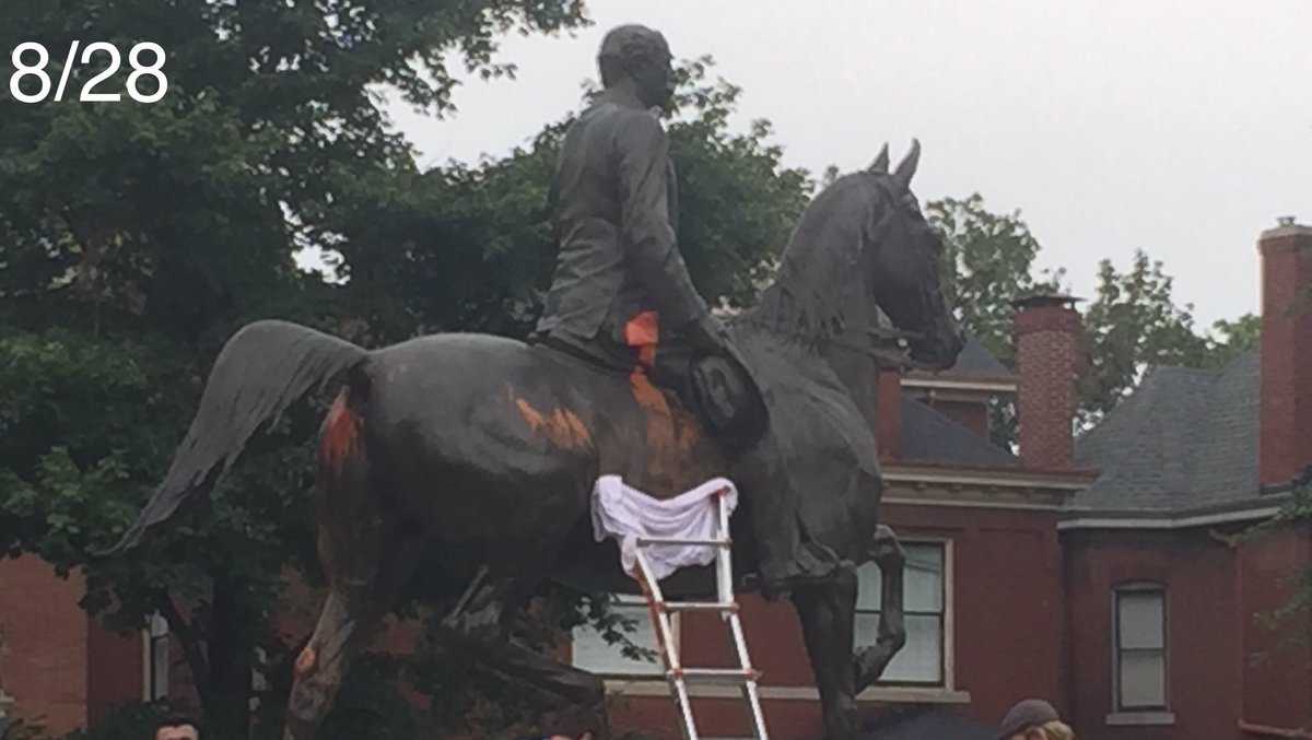 Artists work to restore vandalized Cherokee Triangle statue