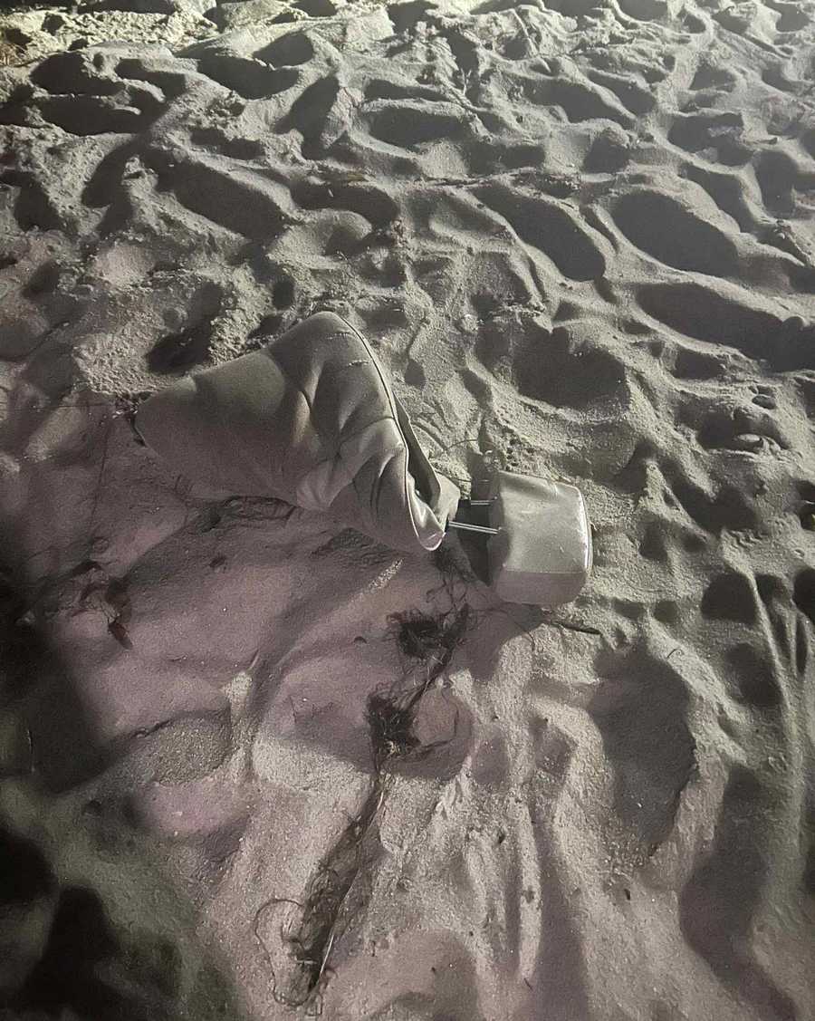 Debris Gathers At Shore Near Sight Of Plane Crash Off Coast Of