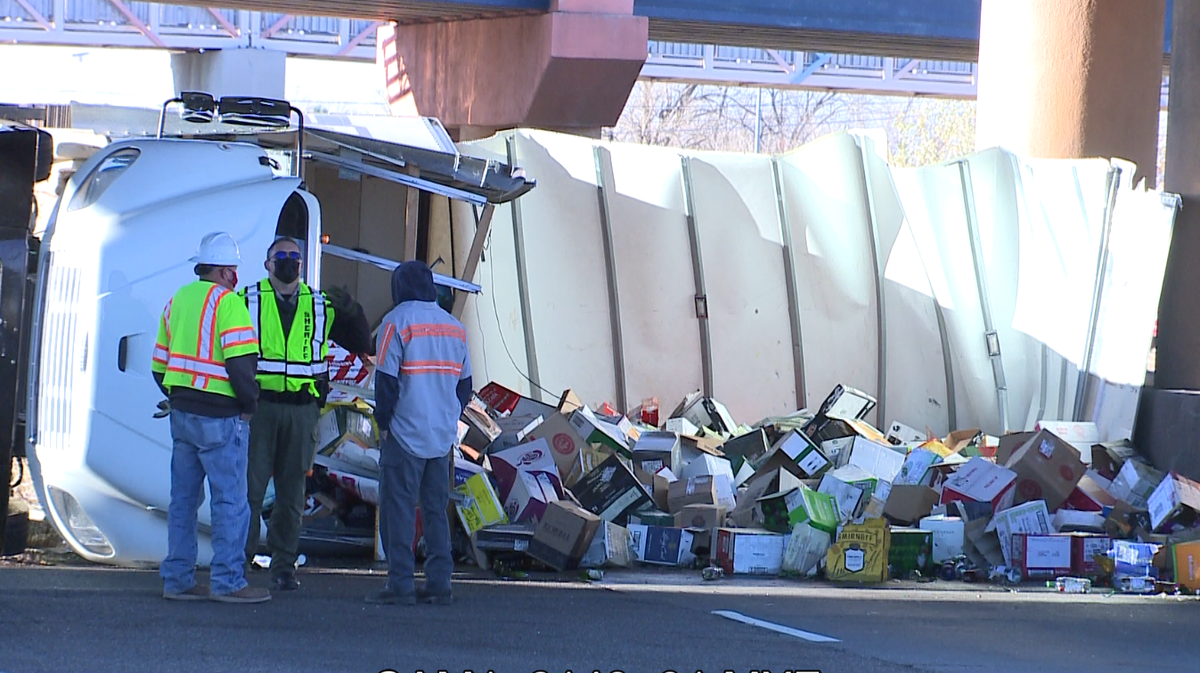 Alcohol delivery truck overturns on busy ABQ road