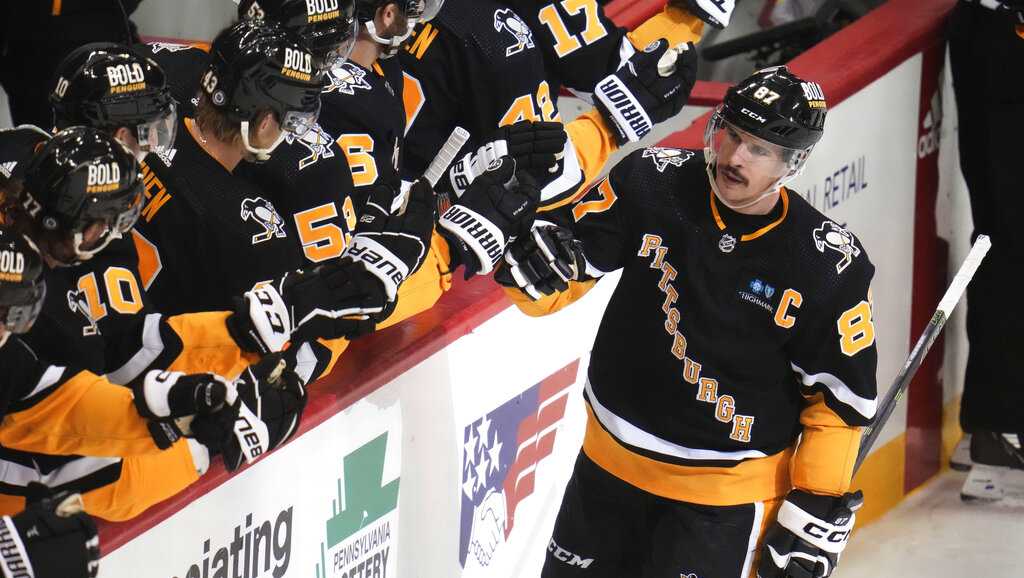 Slavin scores in OT, streaking Hurricanes beat Penguins 4-3