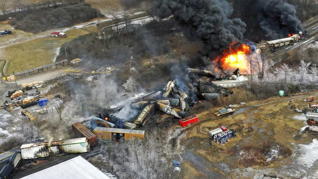 Crews release toxic chemicals from derailed tankers in Ohio