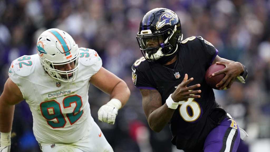 Ravens rout Dolphins 56-19 to clinch top seed in AFC