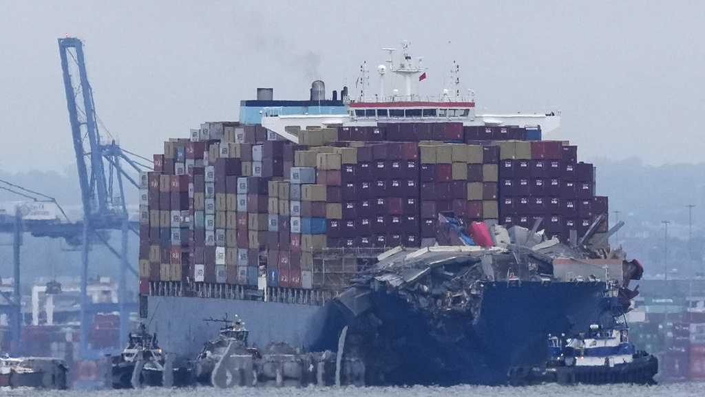 Tugboats escort container ship Dali that caused deadly Baltimore bridge ...