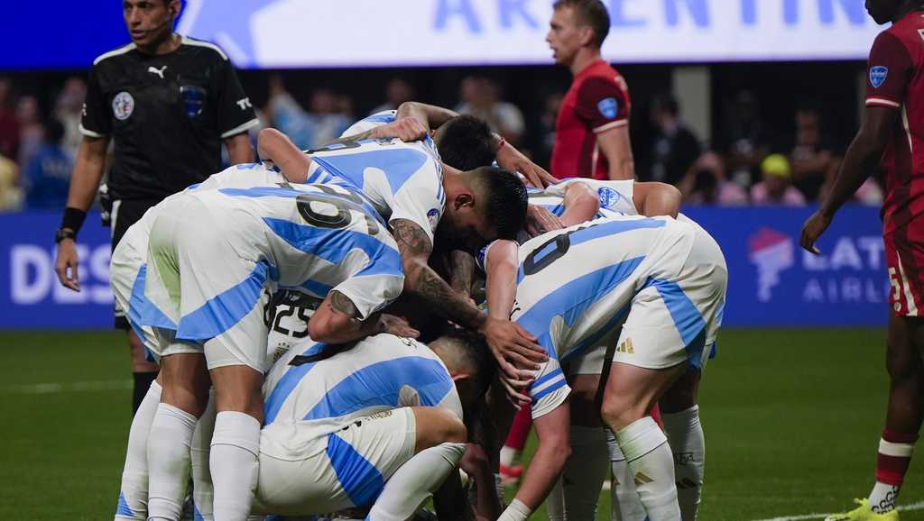 Messi creates both goals as Argentina opens Copa America title defense ...