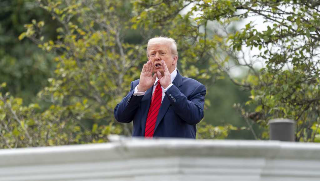 Trump takes unusual walk on White House roof