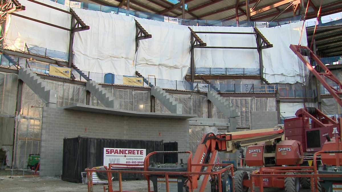 Photos: Crews install first concrete support for seating area inside ...