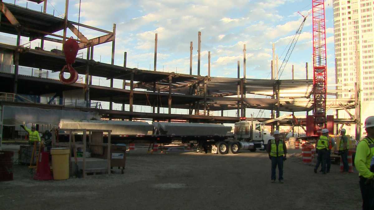 Photos: Crews install first concrete support for seating area inside ...