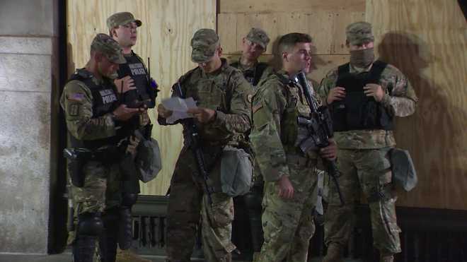 Massachusetts National Guard, military vehicles guarding streets of ...