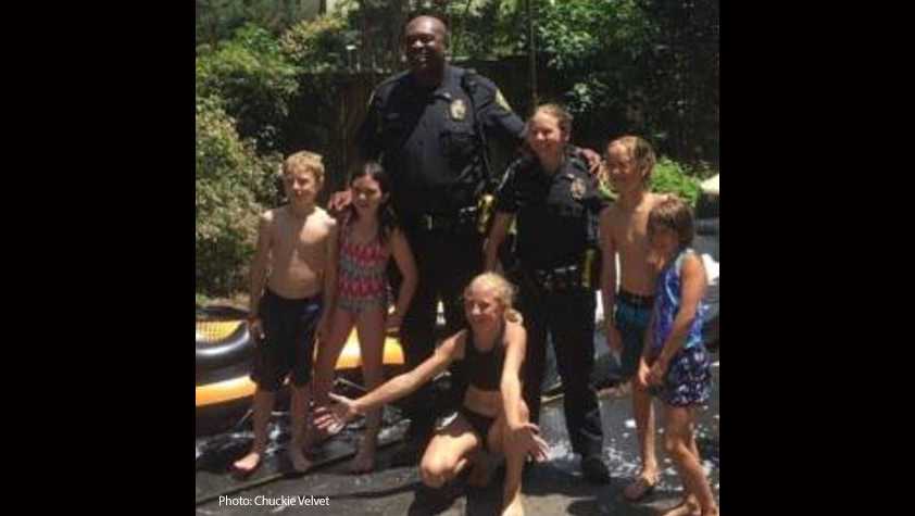 Asheville Police officers go down neighborhood water slide, get ...