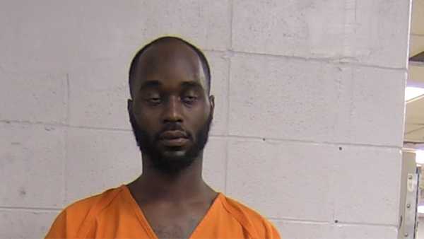 Man arrested, charged with murder in Russell shooting