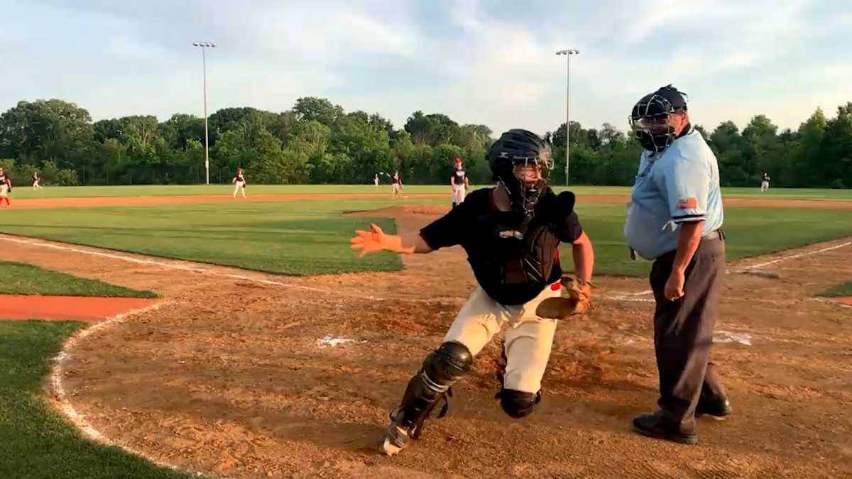 Baseball seemingly disappears after swing and miss