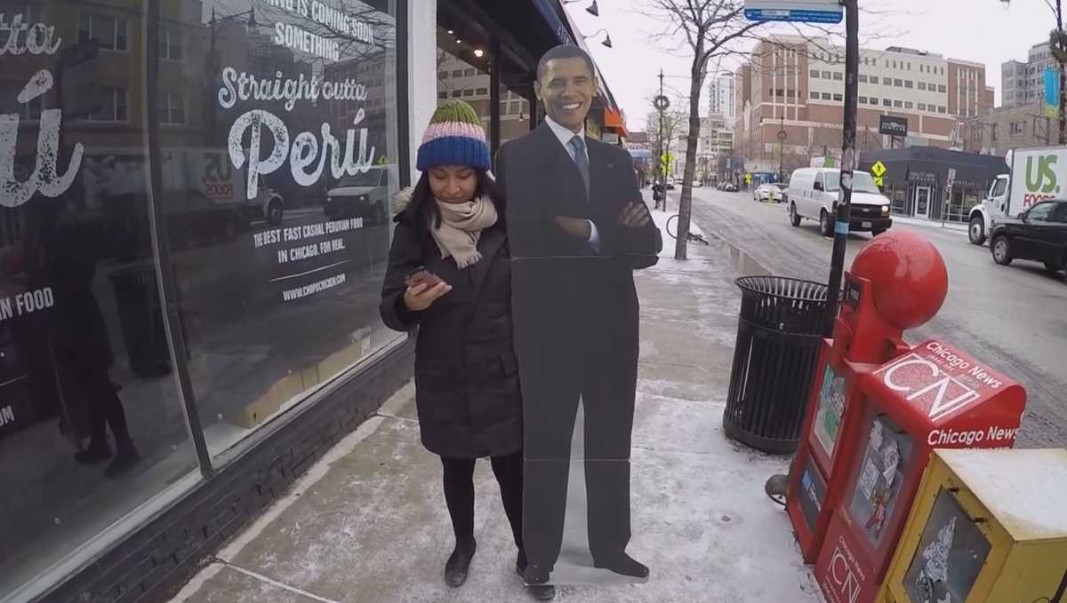 Woman carries life-size Obama cutout