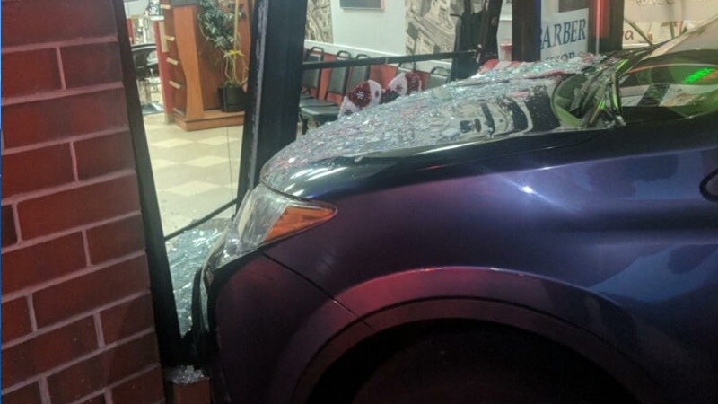 Barber says he narrowly missed being hit by car that crashed into shop