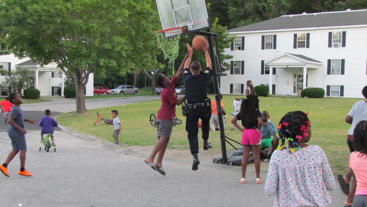 Portland police officers take break to play basketball with kids