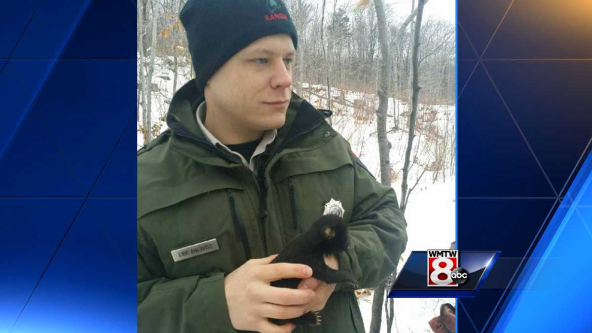 Aww! Maine ranger cuddles bear cub in viral photo