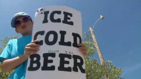 Kid's "Ice Cold Beer" sign fools cops