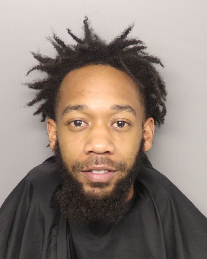 Man in white jumpsuit robs Greenville bank